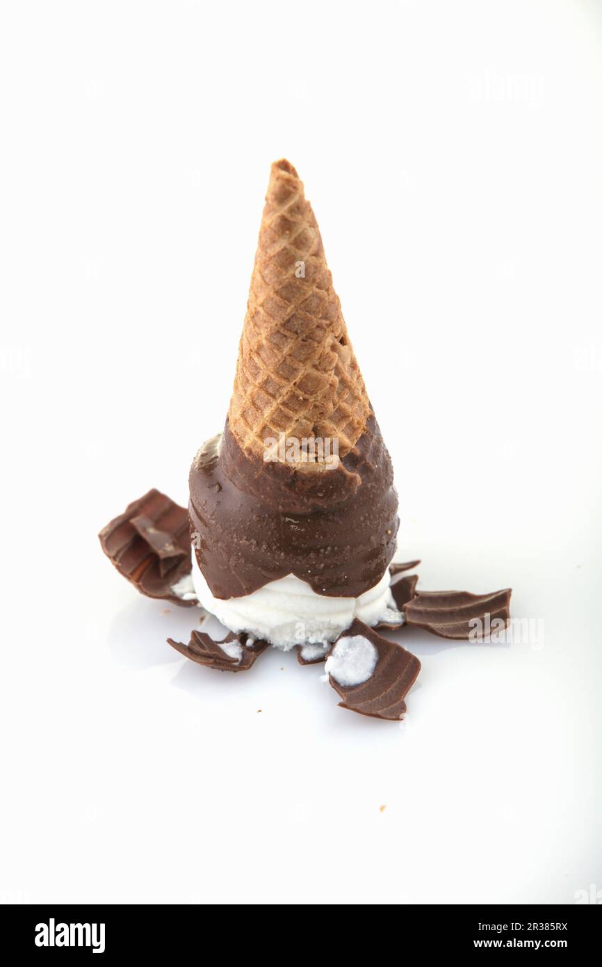 A chocolate-covered ice cream cone tipped upside down Stock Photo - Alamy