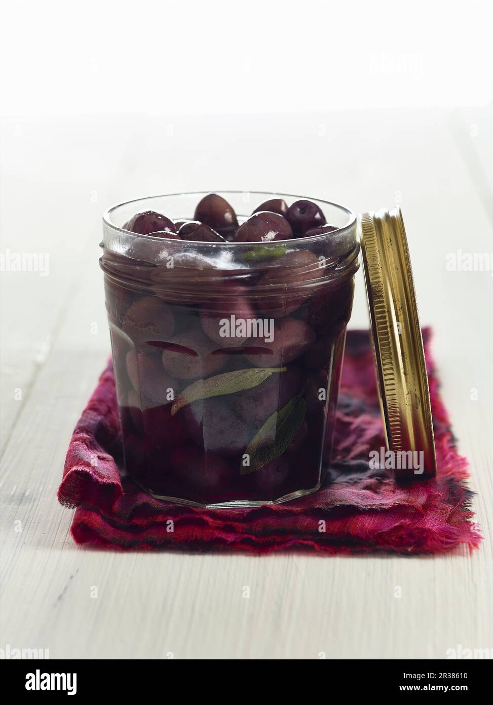 Lacto fermented olives with sage in a mason jar Stock Photo - Alamy