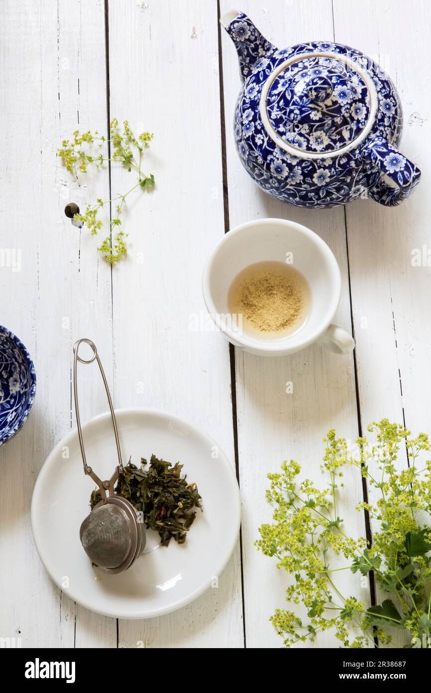 Still life with a blue and white teapot, an empty tea cup, and a tea ...
