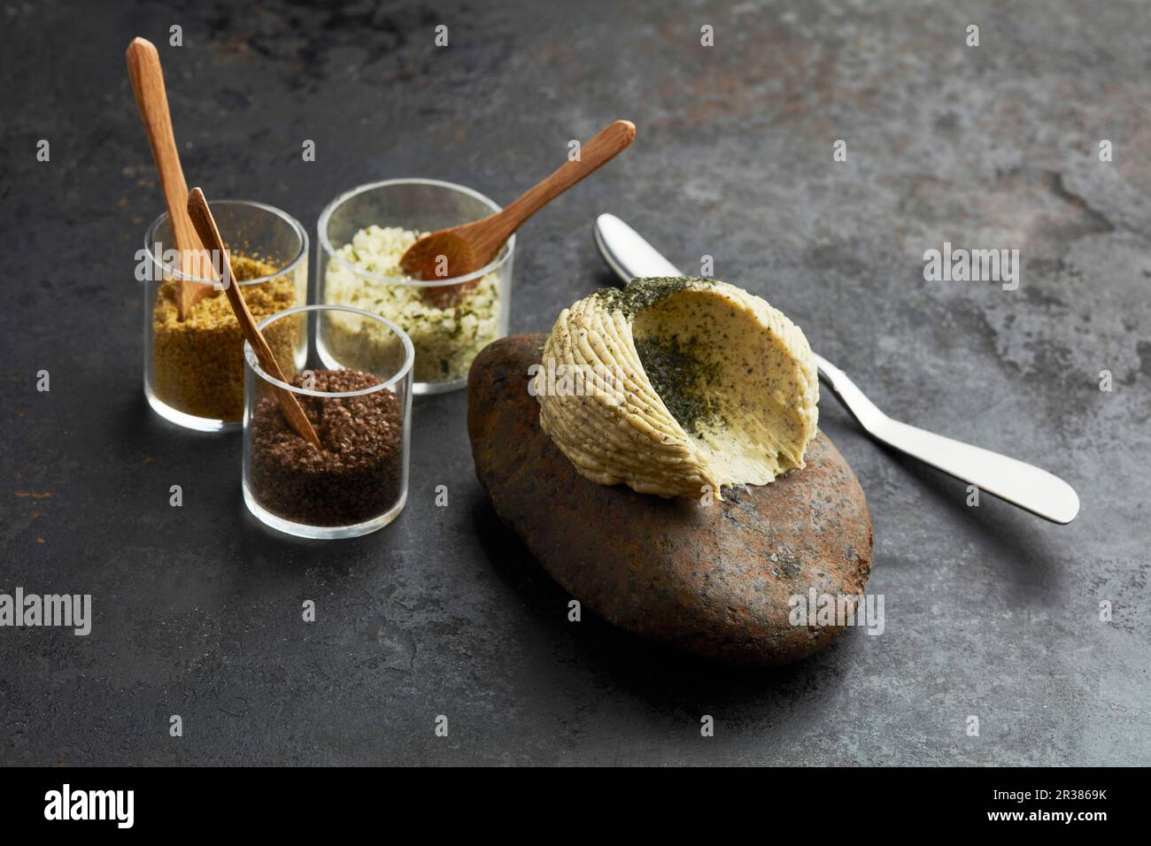 Homemade spice butter with different types of salt in glasses Stock ...