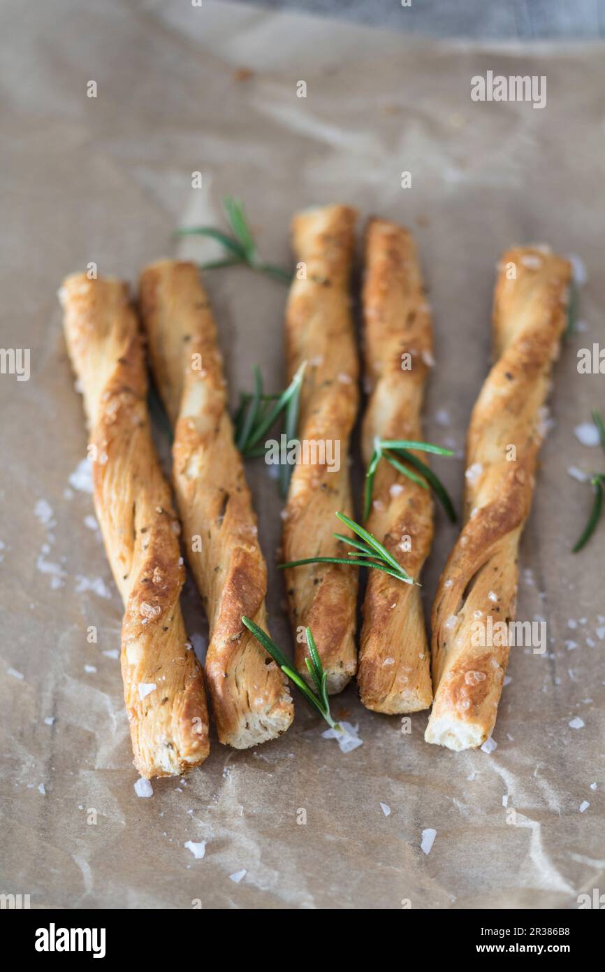Puff pastry sticks with salt and rosemary Stock Photo - Alamy