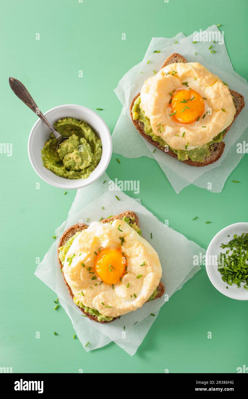 Cloud egg on a toast with avocado Stock Photo - Alamy