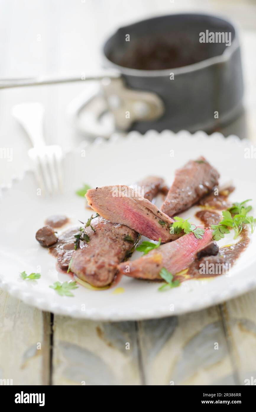 Lamb fillets with herbs Stock Photo - Alamy
