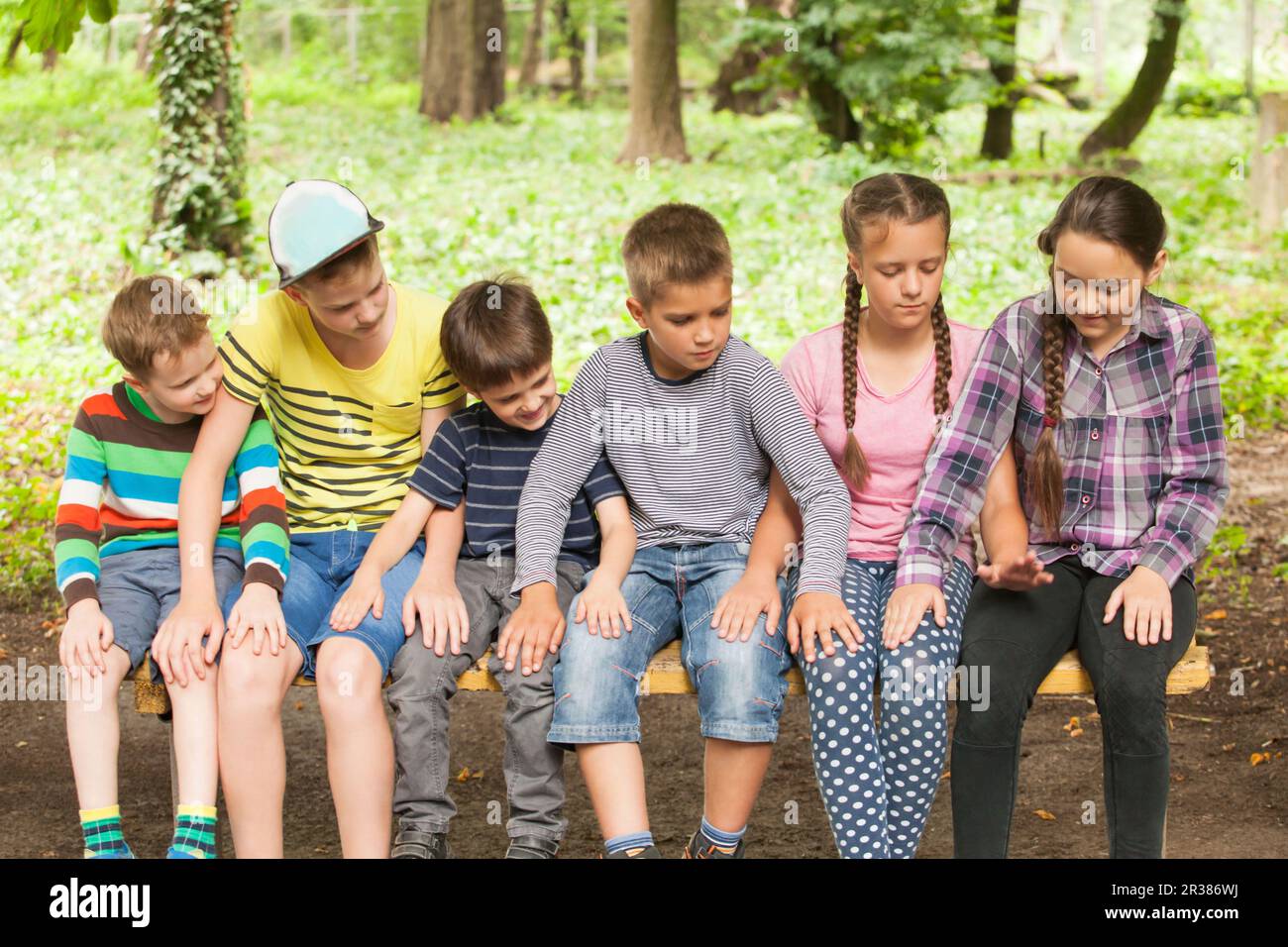 Kids on the bench Stock Photo - Alamy