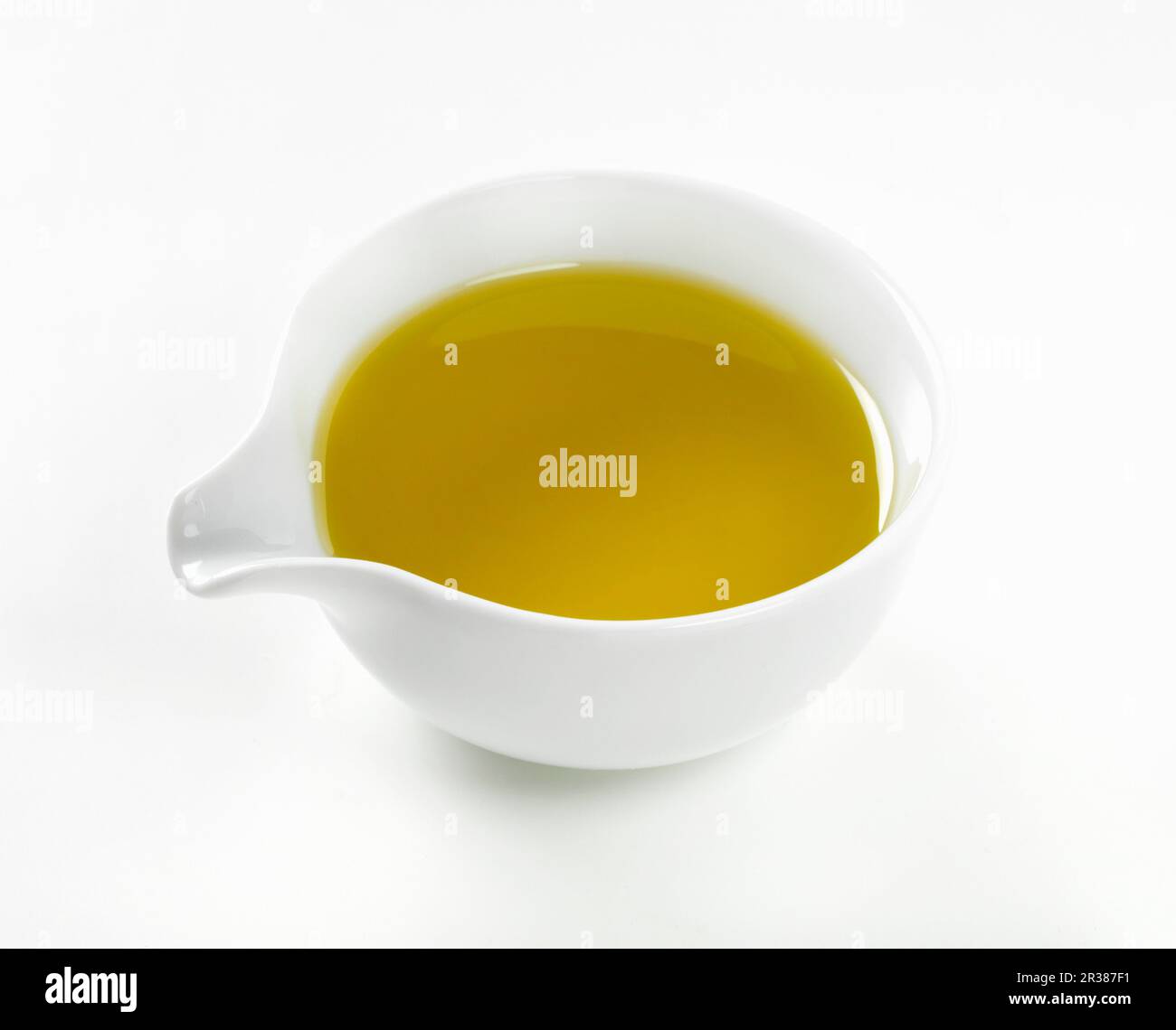 Olive oil in a small bowl Stock Photo - Alamy