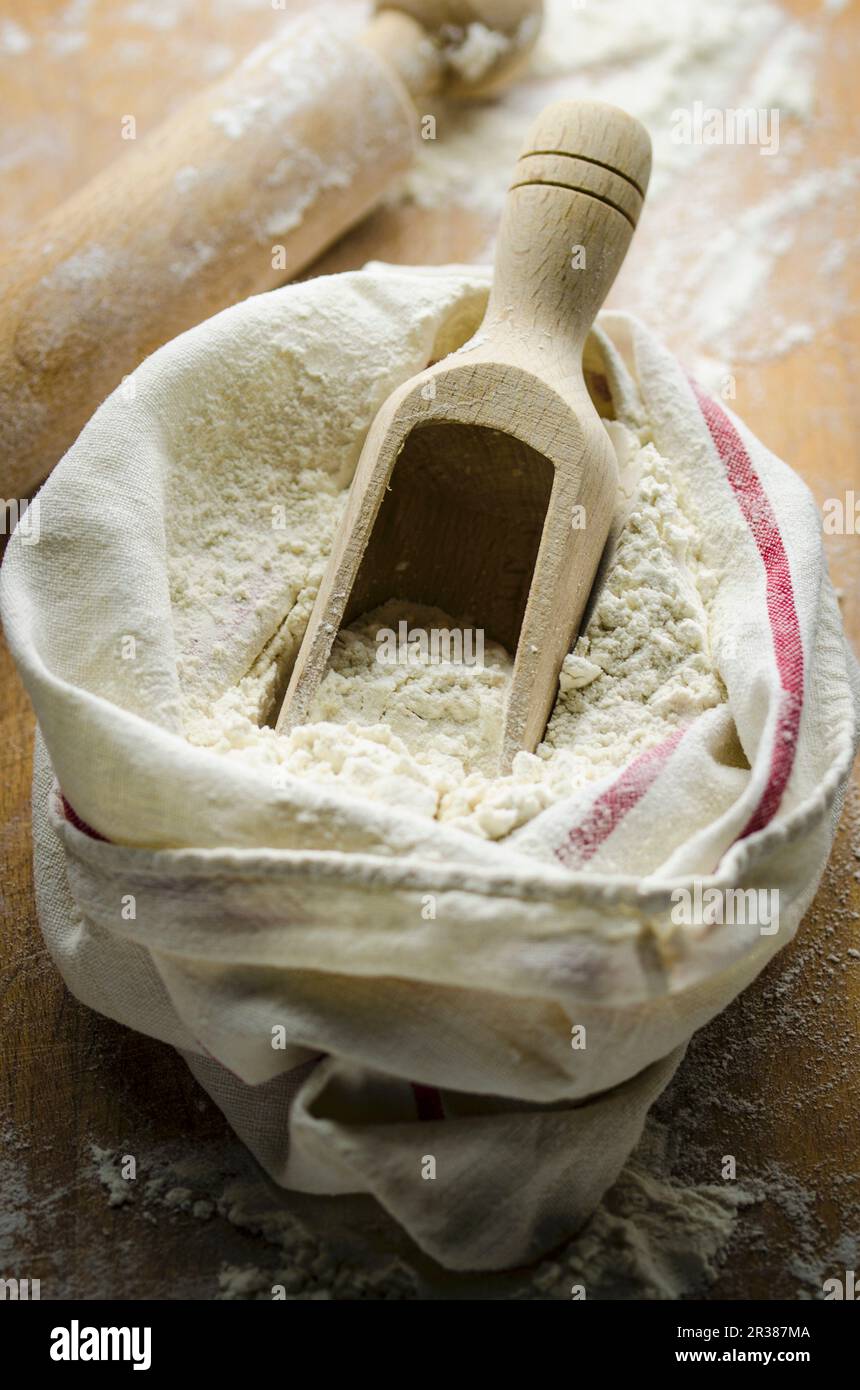 A sack of flour with a scoop Stock Photo - Alamy