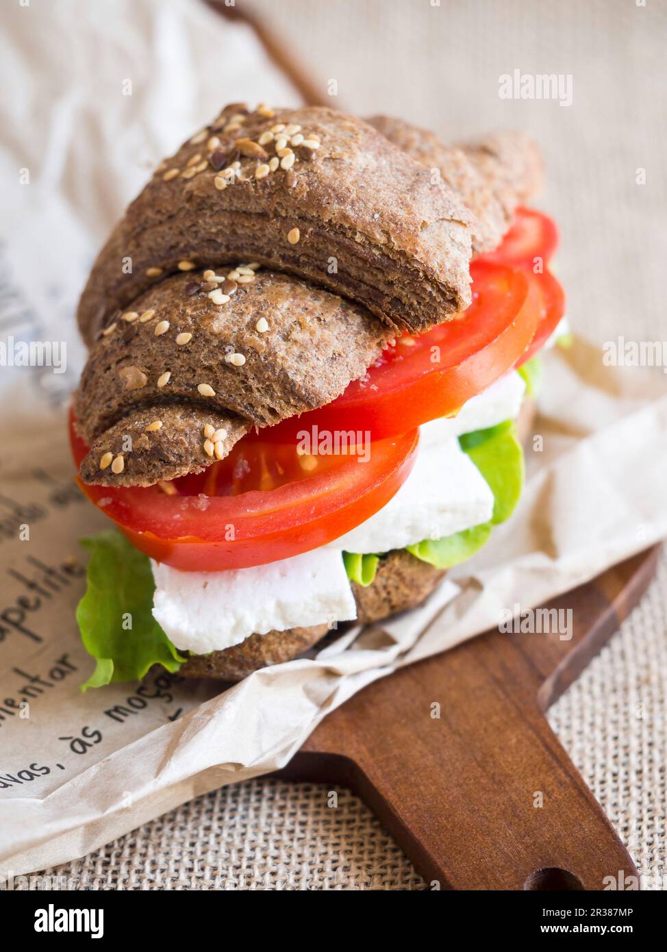 Vegetarian cheese and vegetable sandwich on an whole grain croissant ...