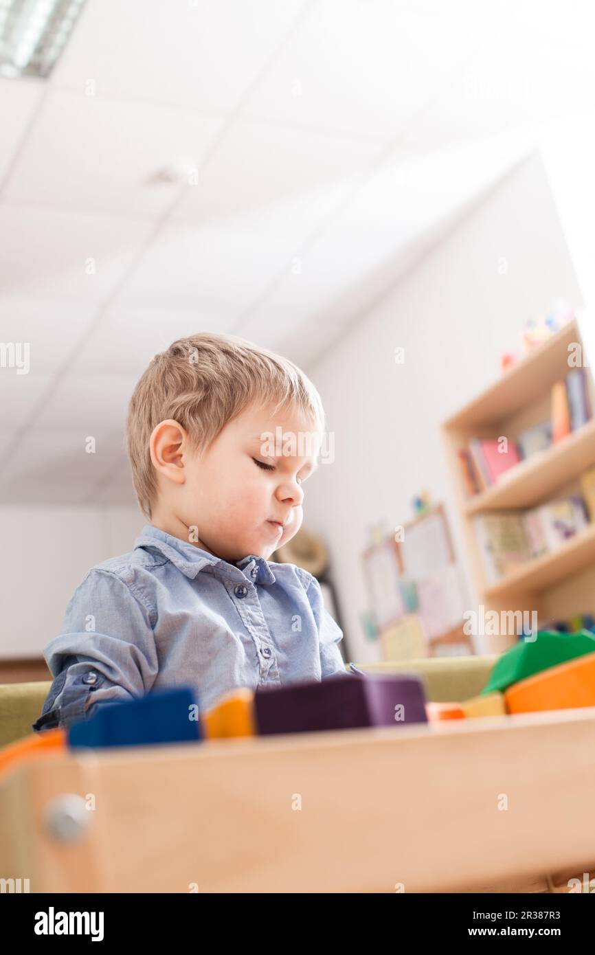 Boy playing with cubes Stock Photo - Alamy
