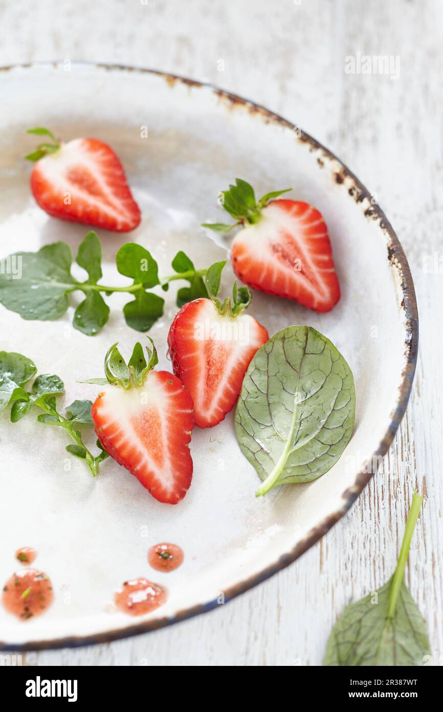 Strawberries in plates background hi-res stock photography and images ...