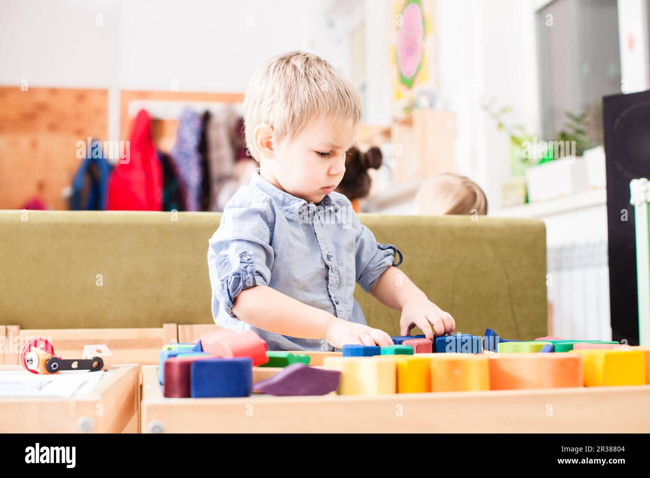 Boy playing with cubes Stock Photo - Alamy