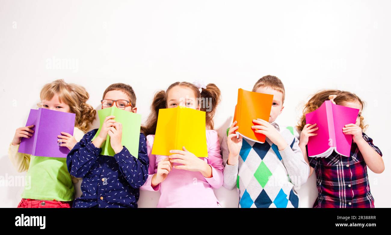 The cute children with books Stock Photo - Alamy