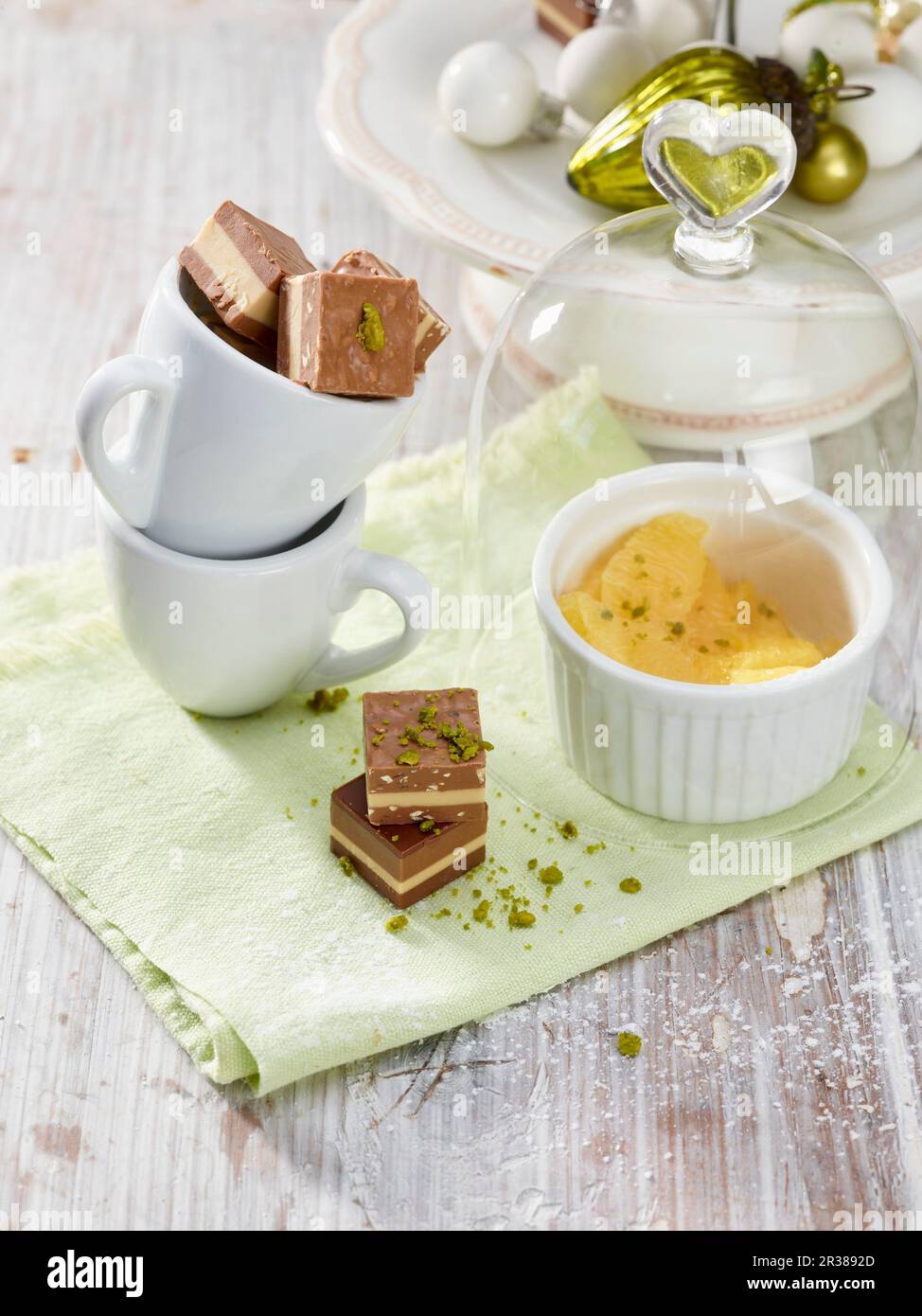 Nougat pralines and orange segments Stock Photo - Alamy