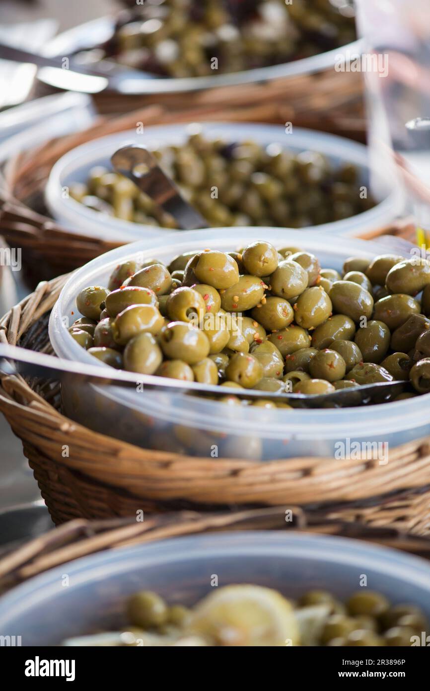 Greek olives with chili peppers at a market stall Stock Photo - Alamy