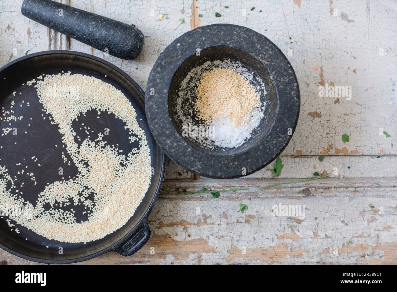 Toasted sesame seeds with salt in a mortar (top view Stock Photo - Alamy