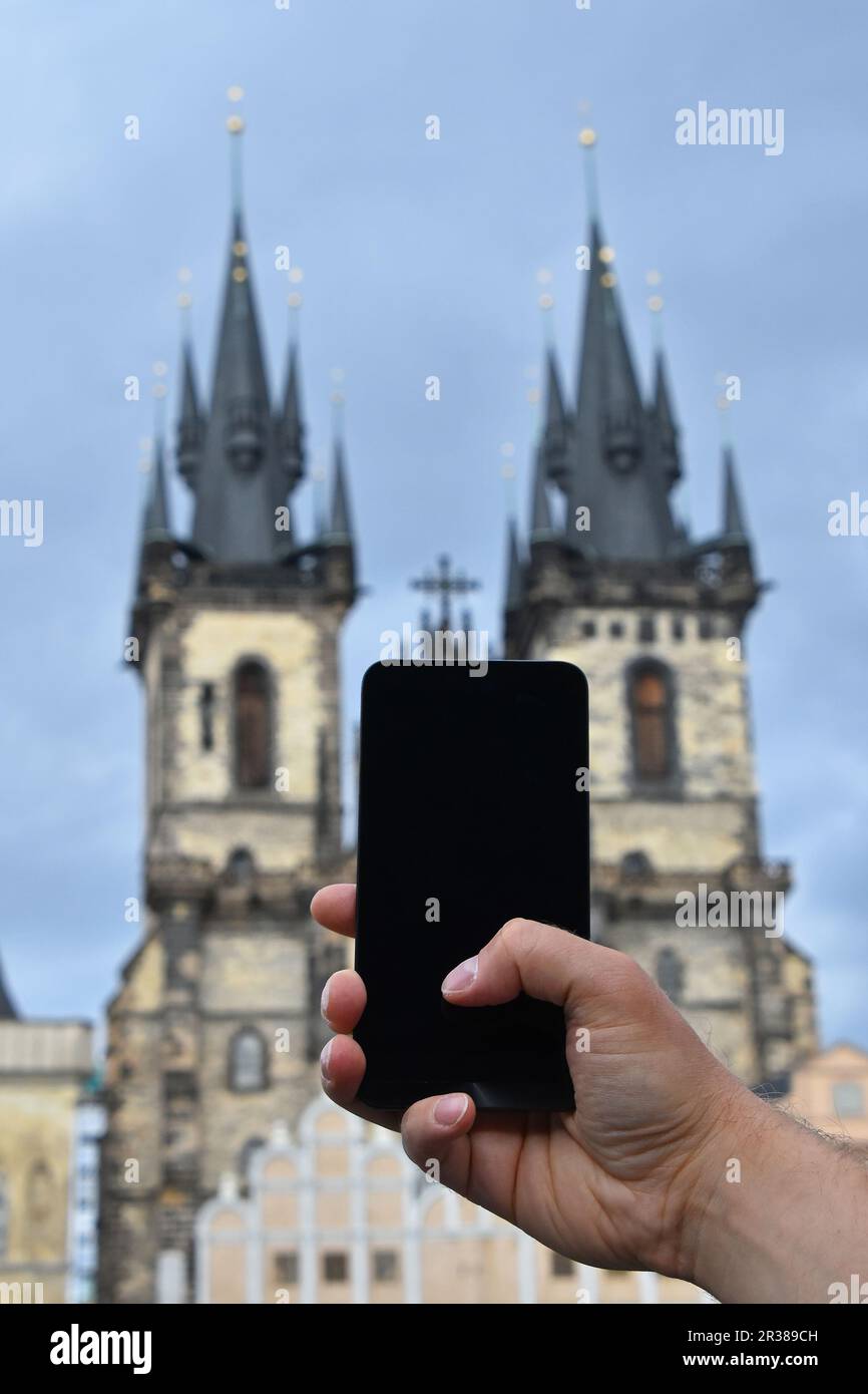 Man hand taking picture of Prague with phone Stock Photo - Alamy
