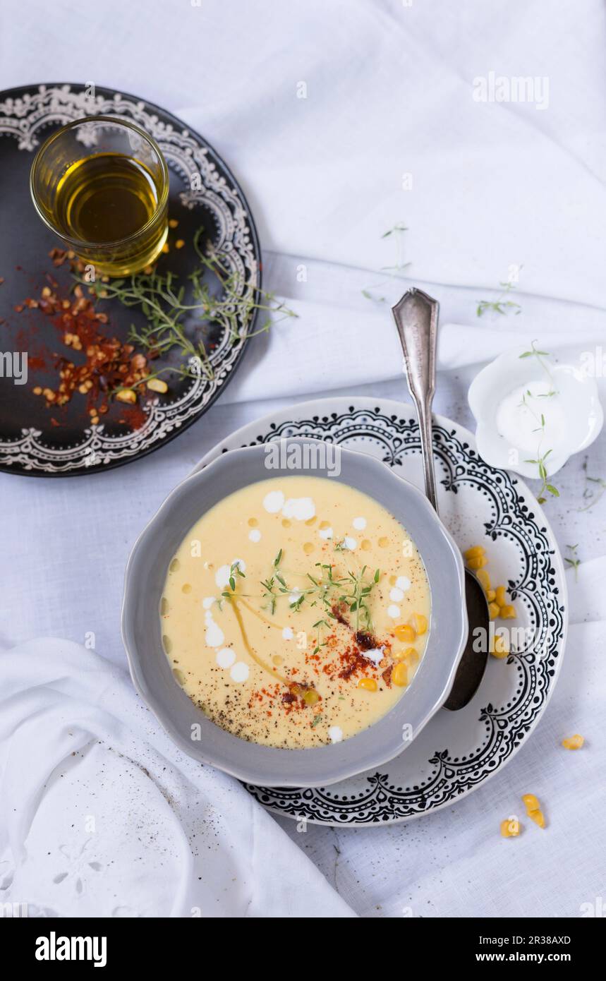 Creme soup with sweetcorn and chili flakes Stock Photo - Alamy