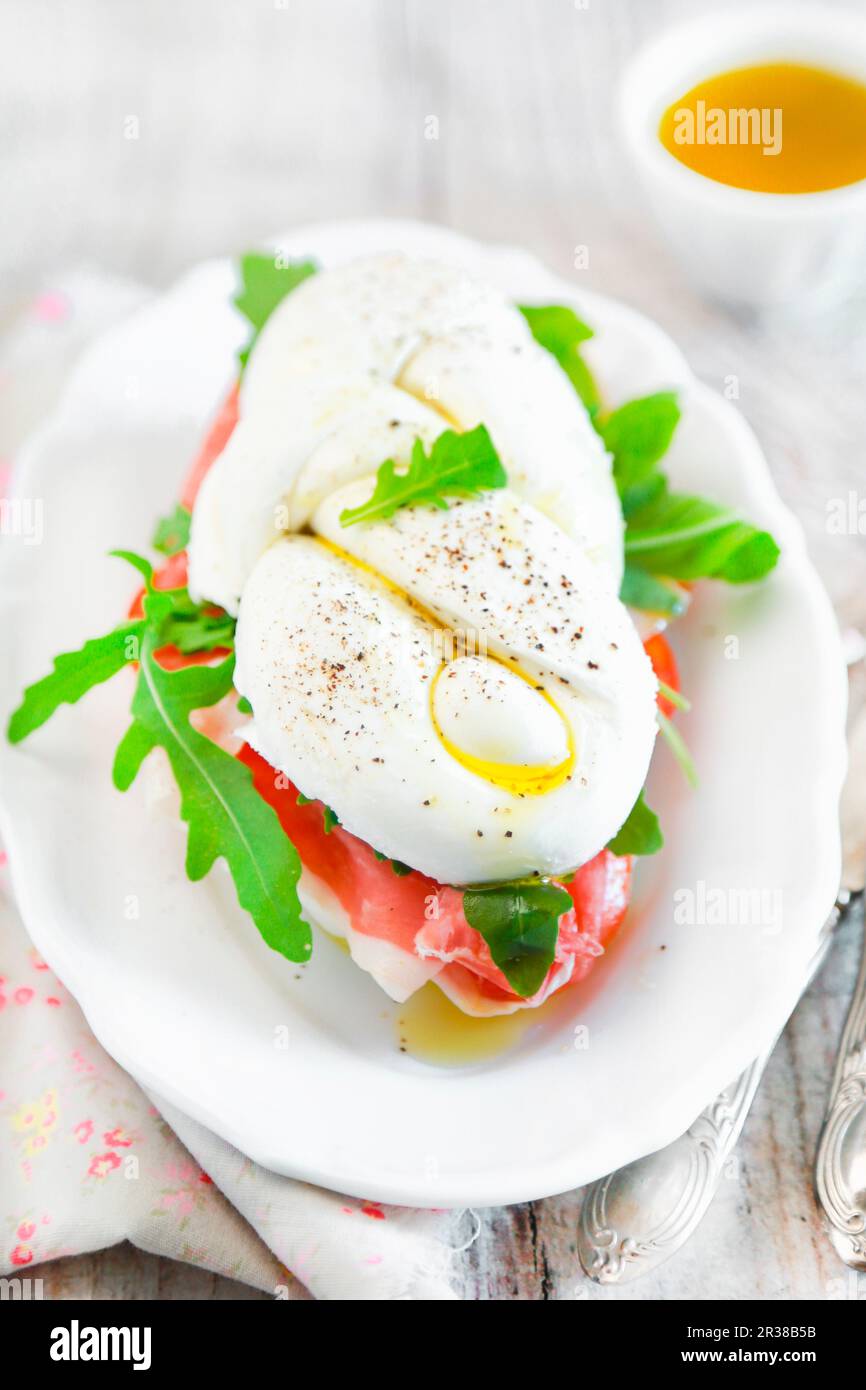 Buffalo mozzarella braid stuffed with parma tomatoes and rocket salad ...