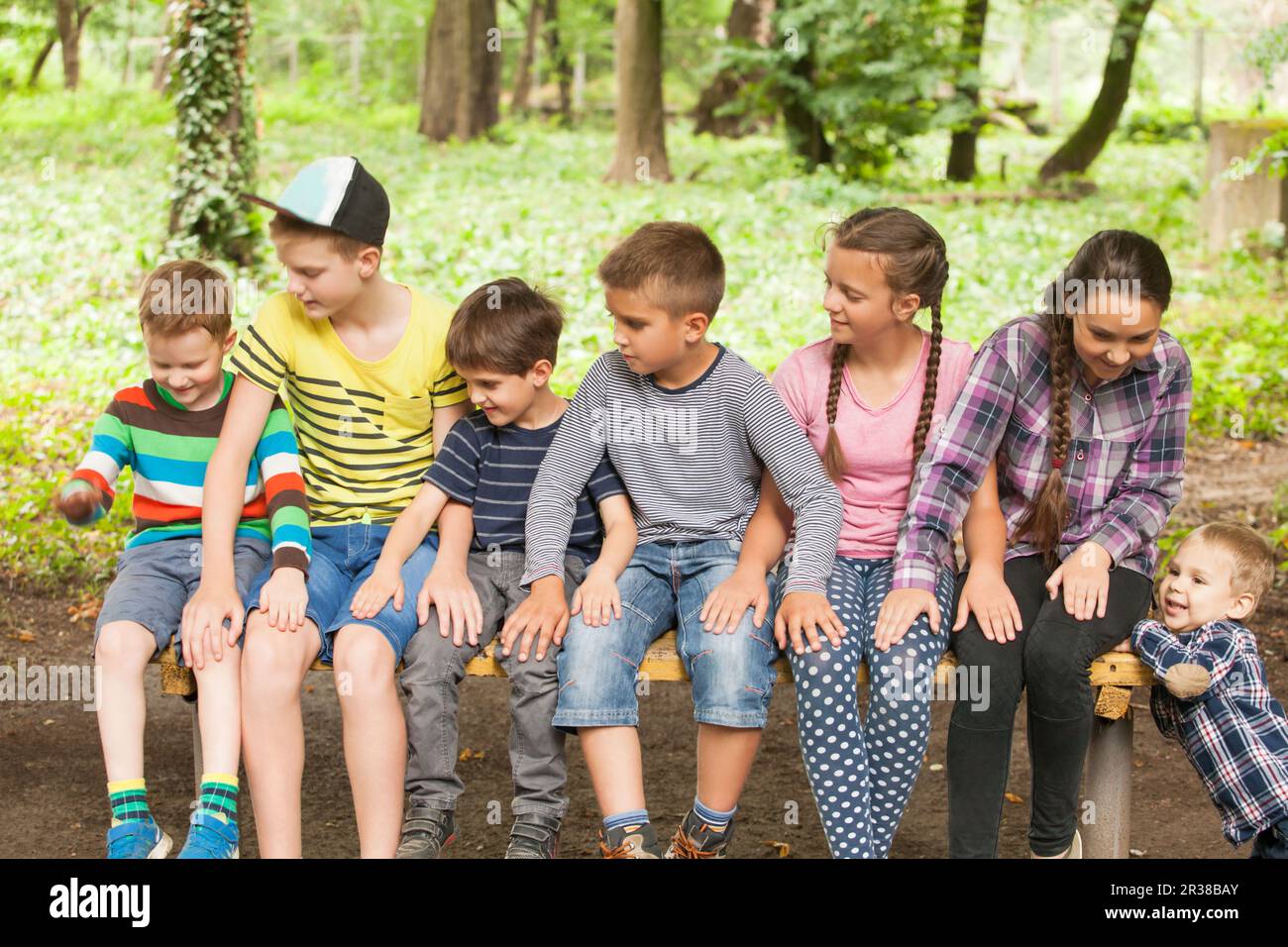 Kids on the bench Stock Photo - Alamy