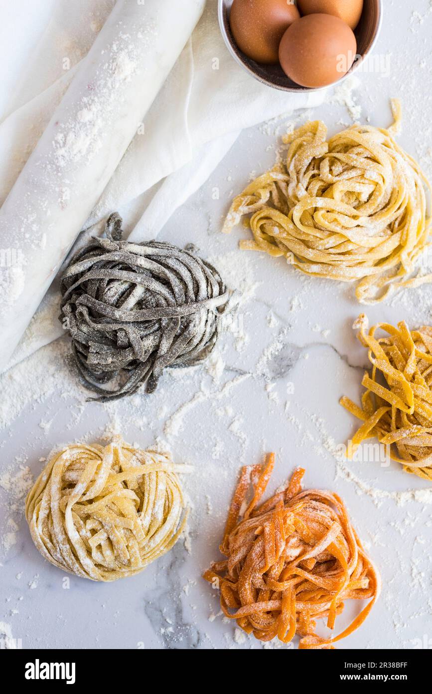 Homemade coloured tagliatelle Stock Photo - Alamy
