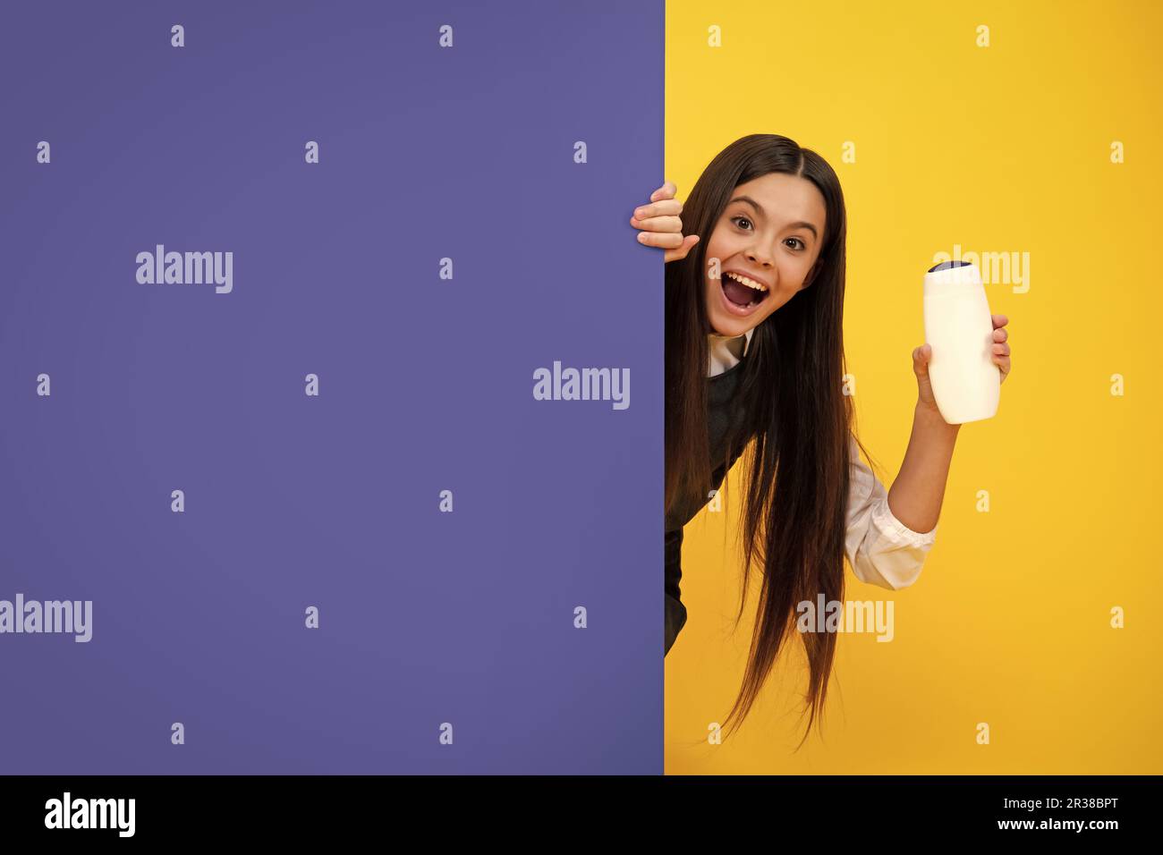 Teenage girl with shampoos conditioners or shower gel. Kids hair care ...