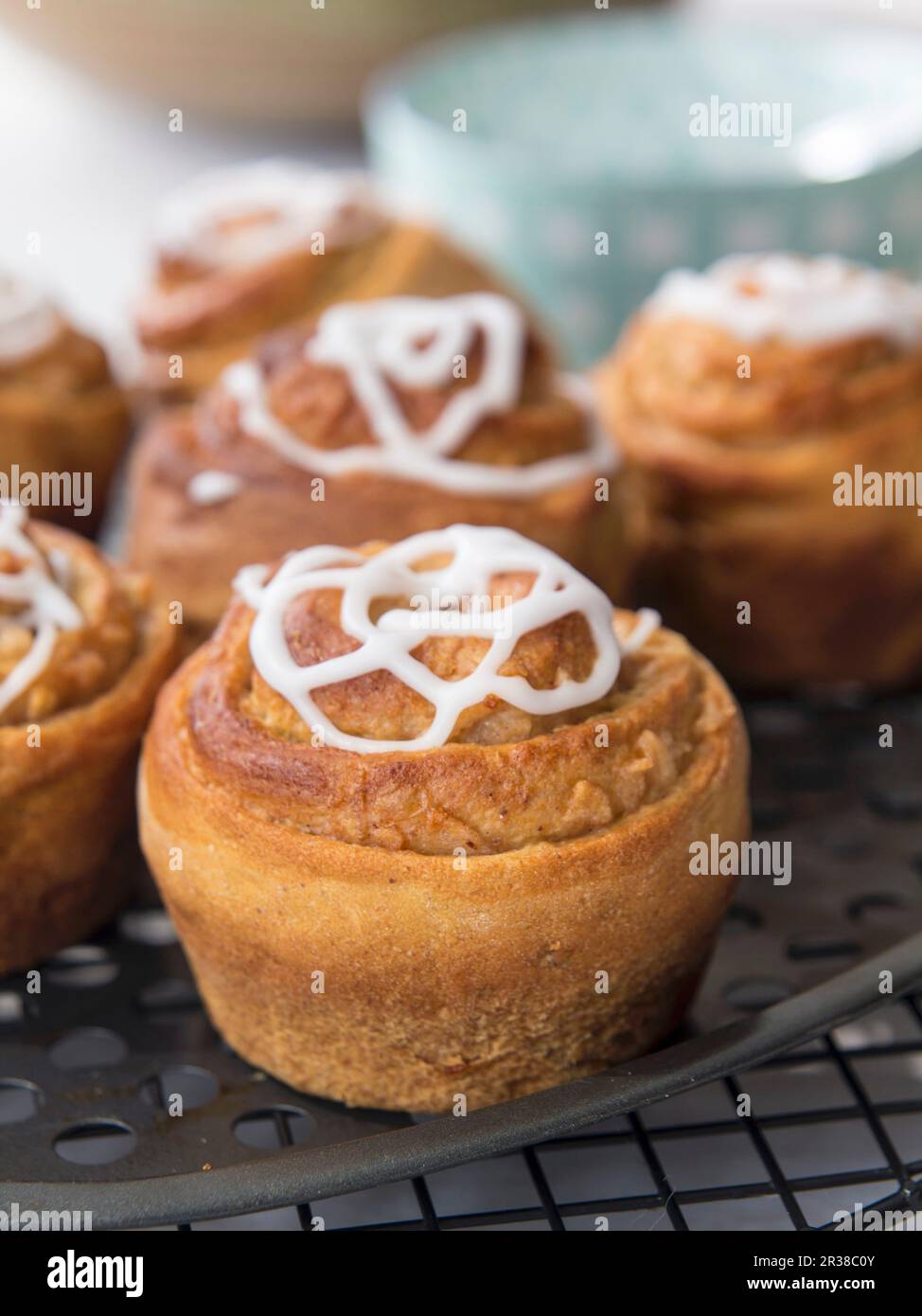 Apple and cinnamon buns with icing Stock Photo - Alamy