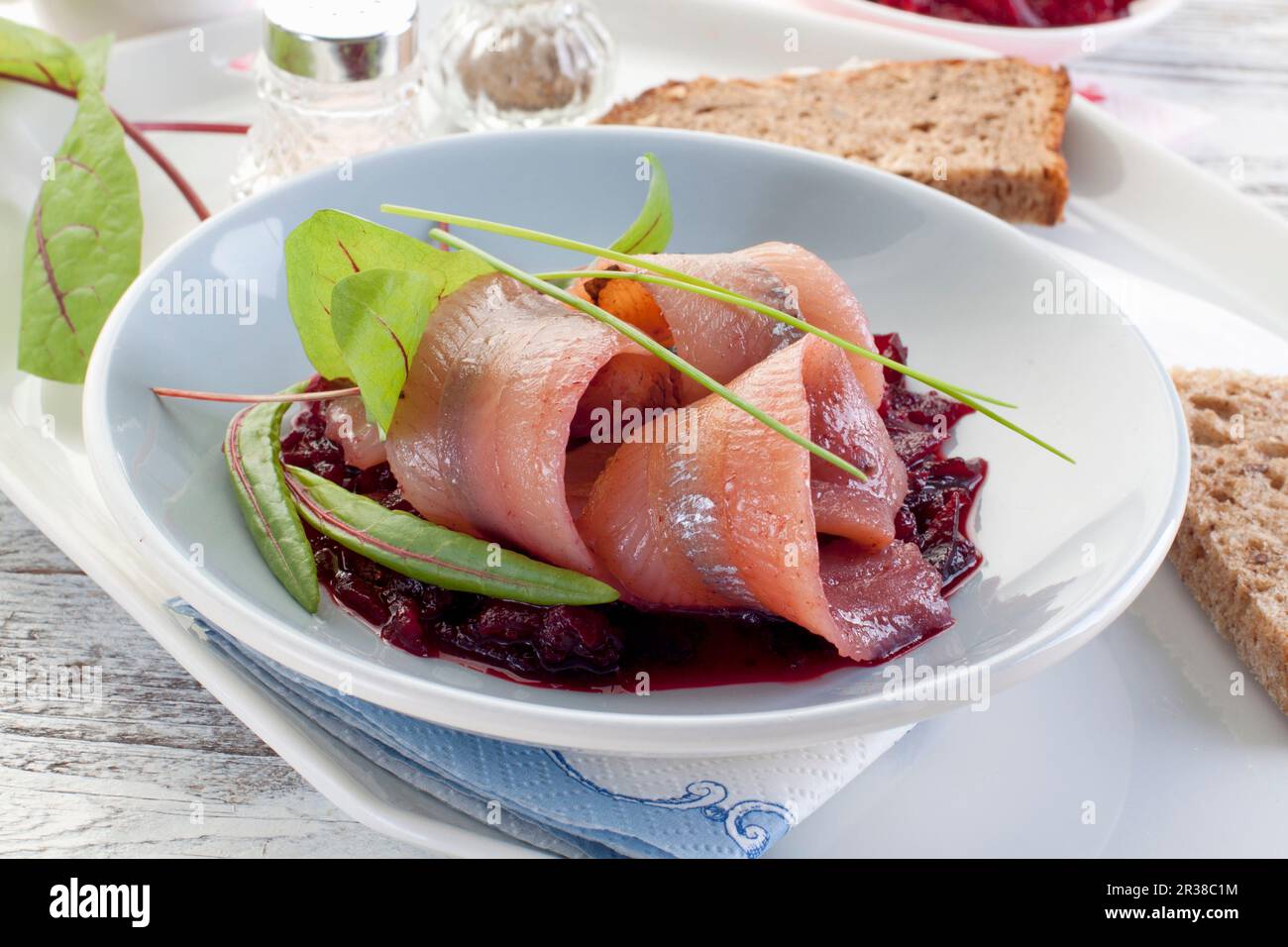 Marinated herring fillets with beetroot Stock Photo - Alamy