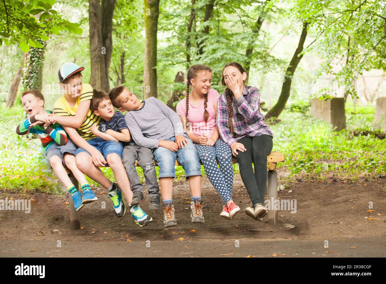 Kids on the bench Stock Photo - Alamy