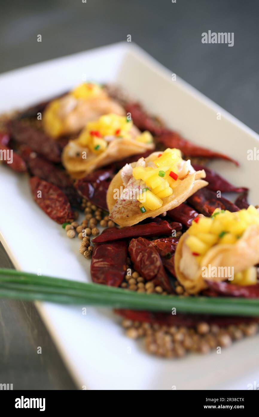 Mini fish tacos with mango salsa Stock Photo - Alamy