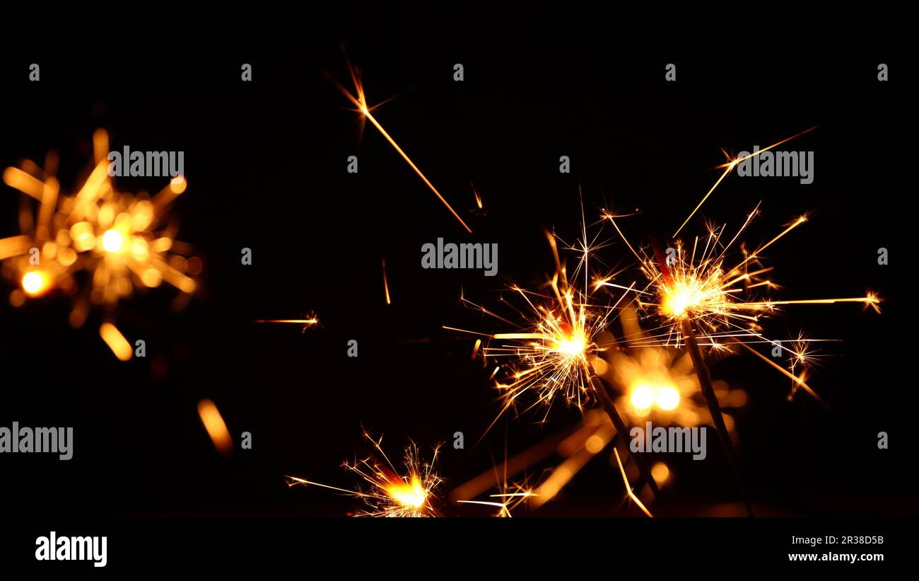 Close up several firework sparklers over black Stock Photo - Alamy