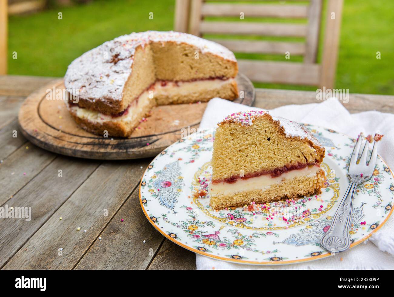 Victoria sponge cake with jam, buttercream, icing sugar and colourful ...