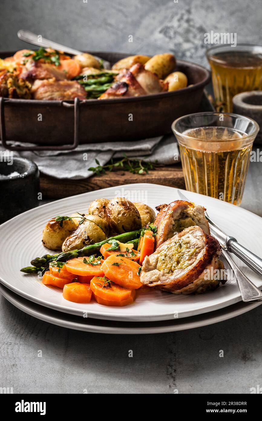 Stuffed Chicken Thighs with Vegetables Stock Photo - Alamy