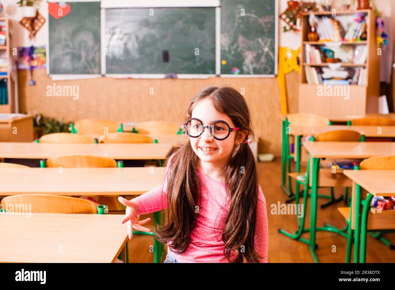 Happy smart girl in classroom Stock Photo - Alamy