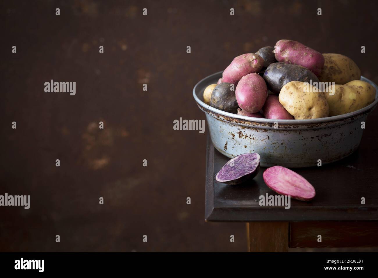 Colorful potatoes in a metal bowl Stock Photo - Alamy