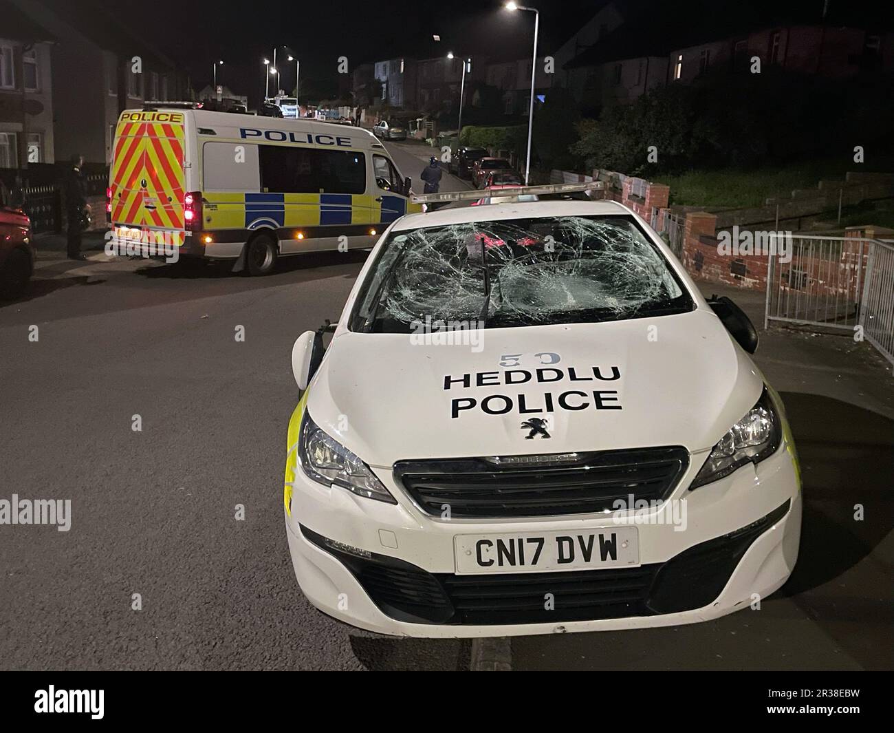 A police car with a smashed windsrceen in Ely, Cardiff, during a "large ...