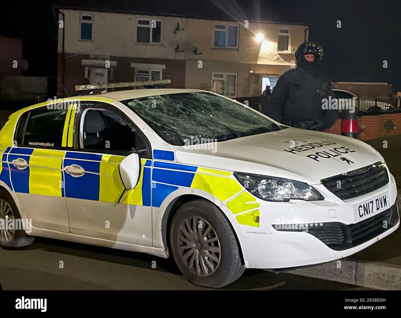 A police car with a smashed windsrceen in Ely, Cardiff, during a "large ...