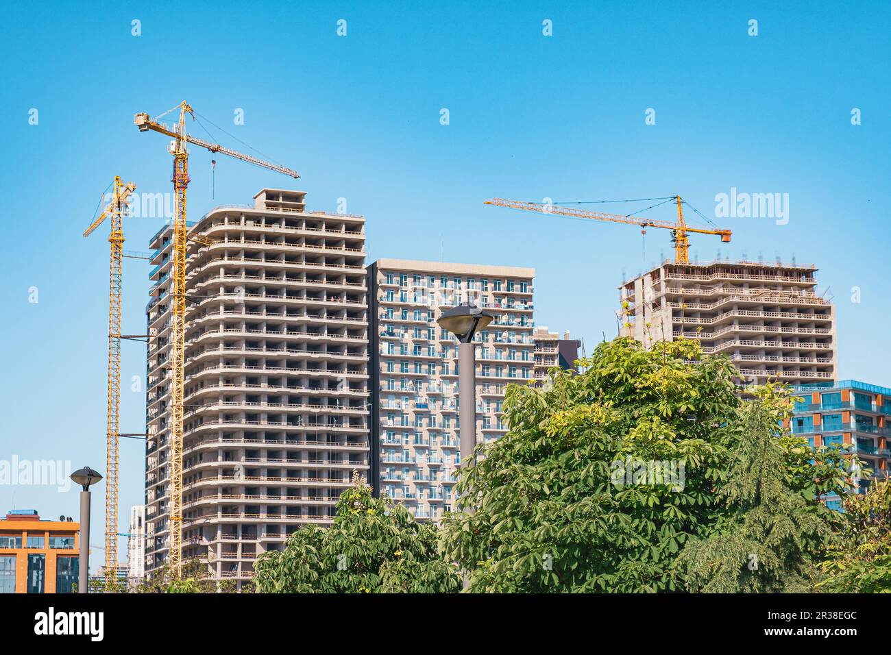 Cranes builds multistorey house on construction site in the city ...
