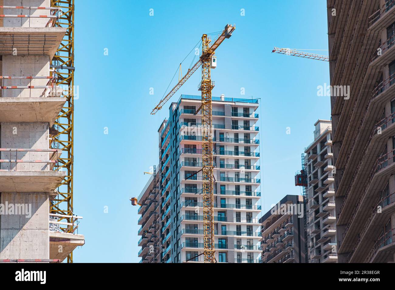 Cranes builds skyscraper house on construction site in the city ...