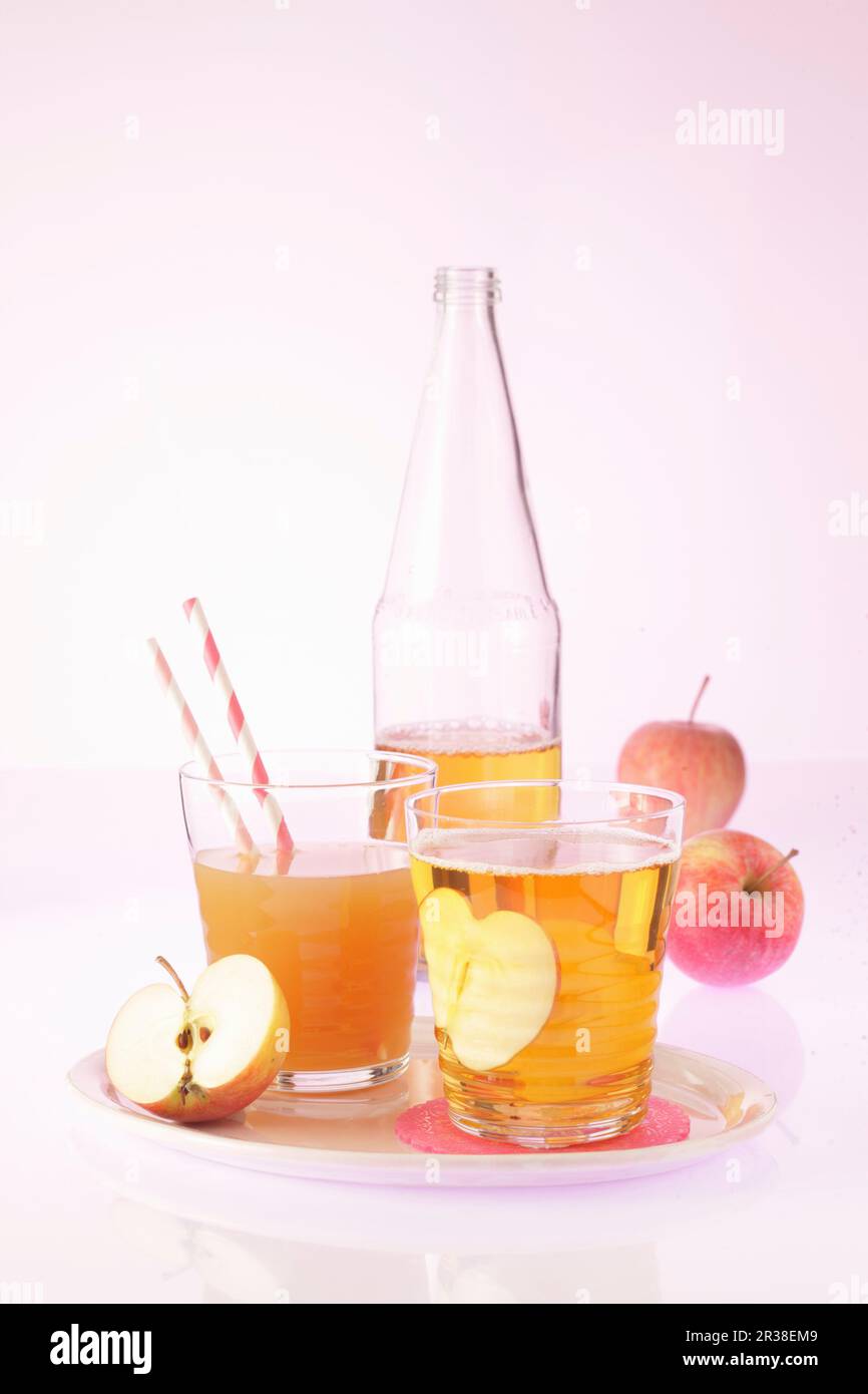 An arrangement of fruit juices (apple juice, and pear and orange juice ...