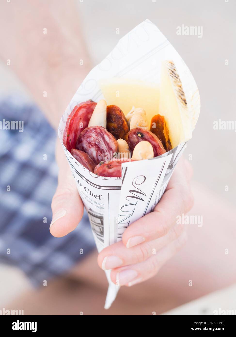 A selecion of Manchego cheese and different salami types sold as a ...