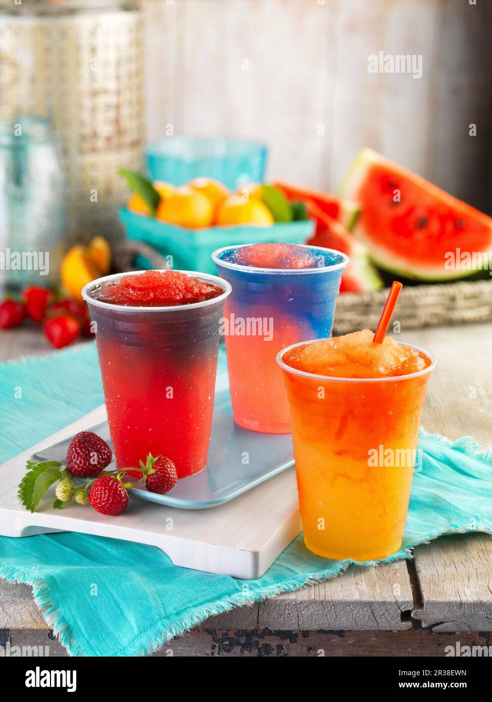 Three different fruity slushies in plastic cups Stock Photo - Alamy