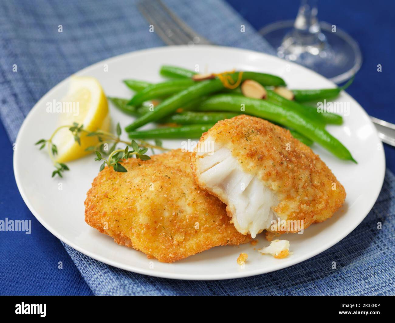 Breaded cod fillets with green beans Stock Photo - Alamy