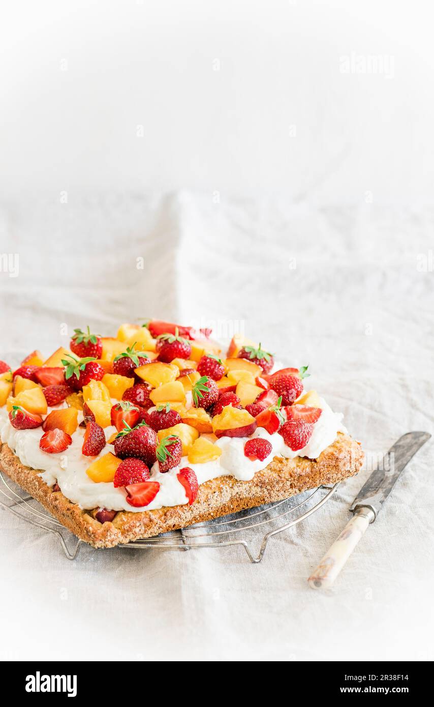 Peach and strawberry cake with mascarpone curd cream on a marzipan base ...