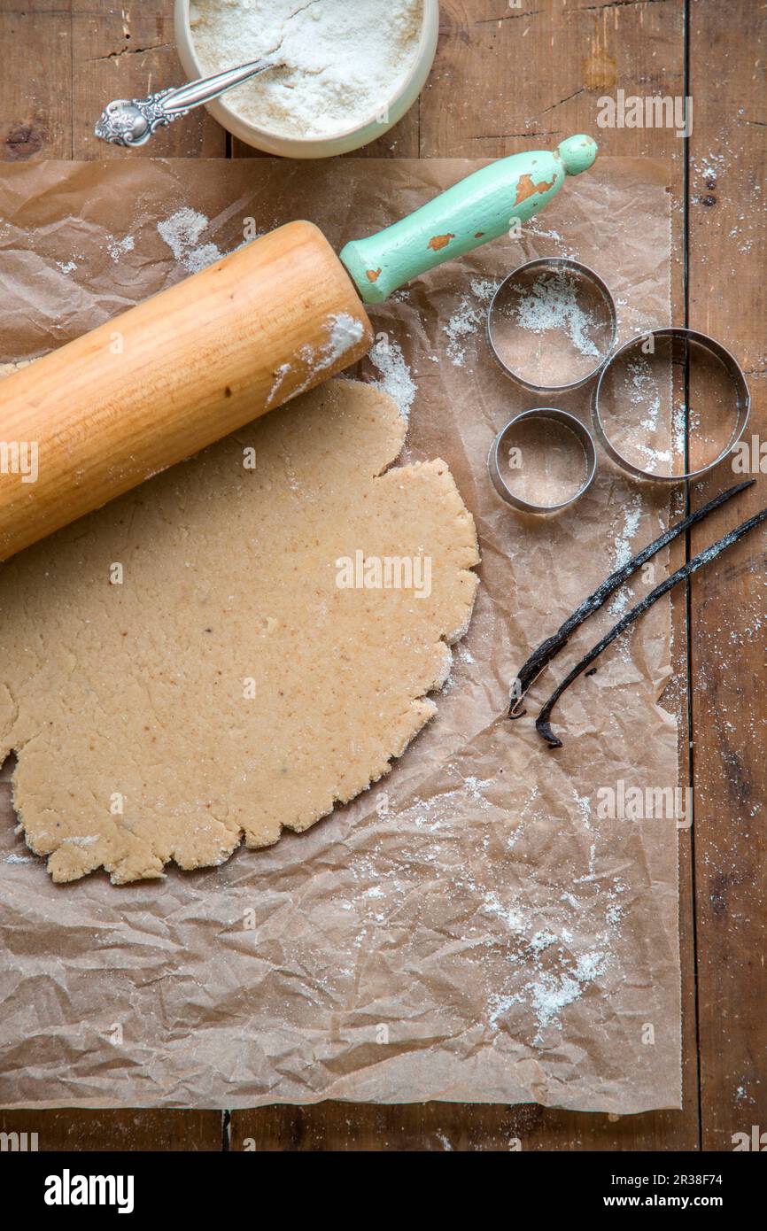 Vegan biscuit dough on baking paper with a rolling pin Stock Photo - Alamy