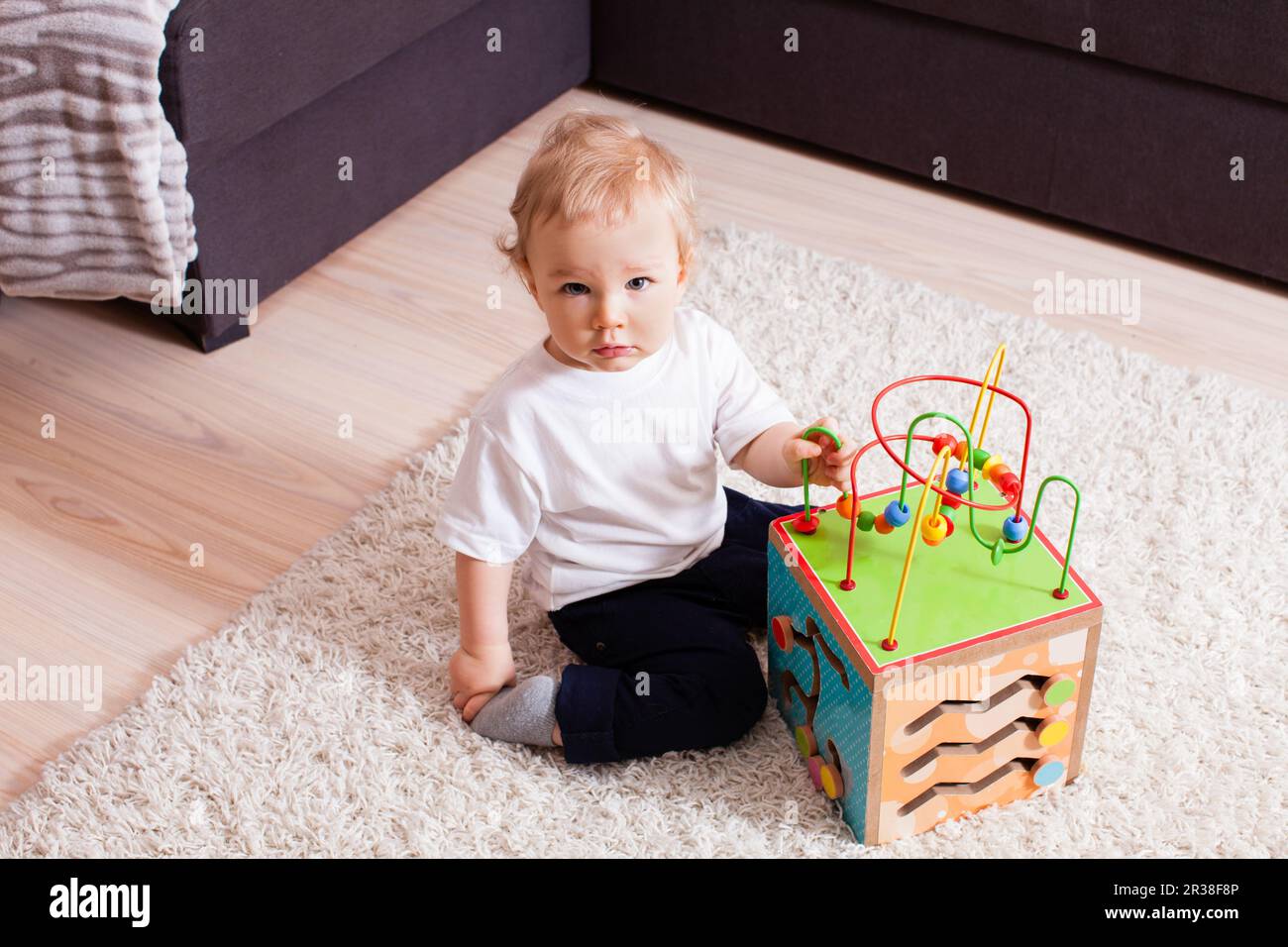 Smart boy wants to play with very interesting toy Stock Photo - Alamy