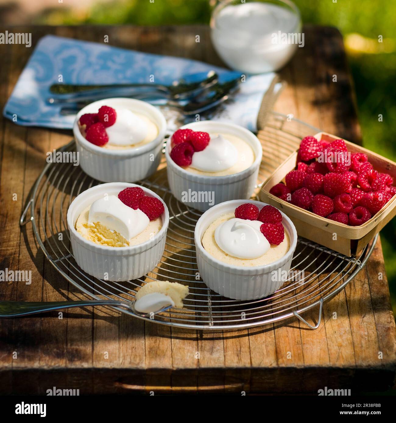 Lemon goat's cheese soufflés with raspberries Stock Photo - Alamy