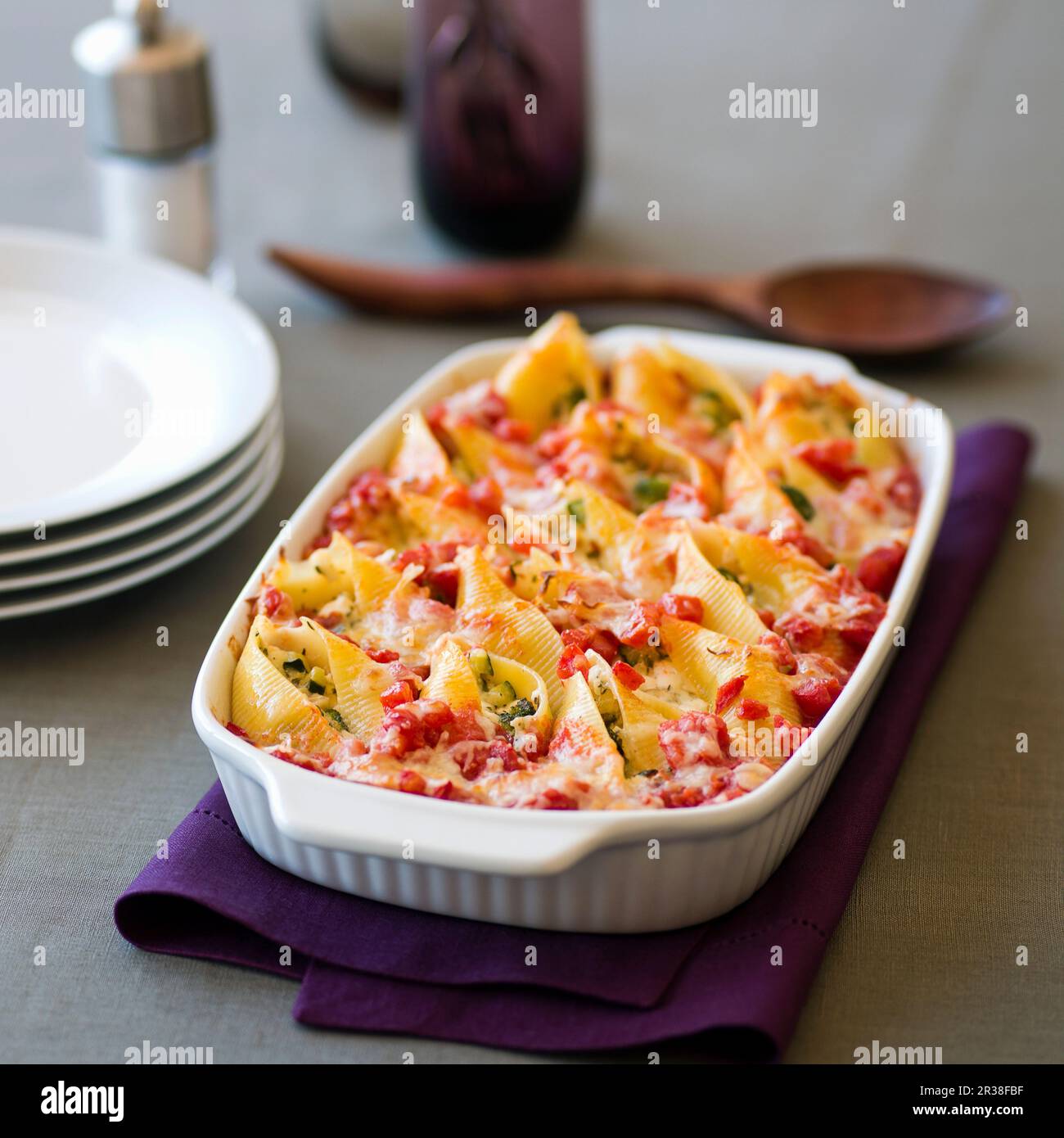 Shell pasta with a cheese and vegetable filling in a baking dish Stock ...