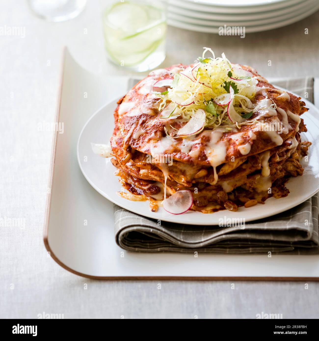 A stack of enchiladas with minced meat, beans and cheese (Mexico Stock ...