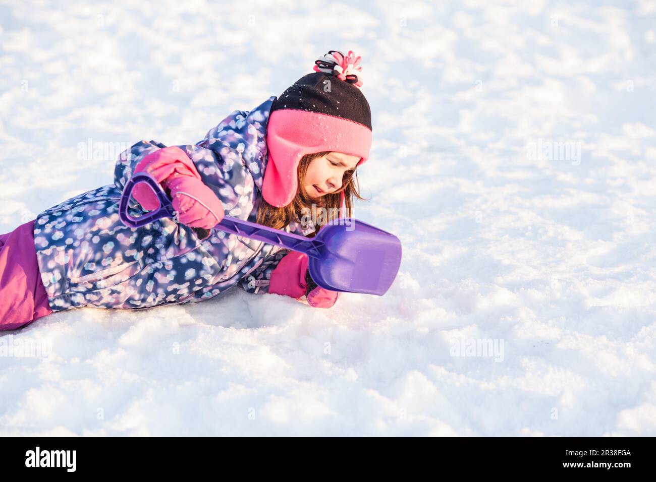 Child girl shovel snow hi-res stock photography and images - Alamy