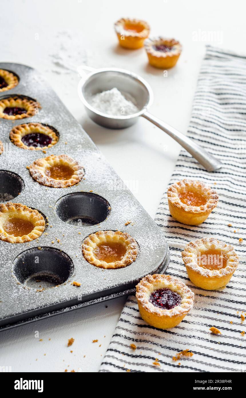 Mini apricot and raspberry jam tartlets Stock Photo - Alamy