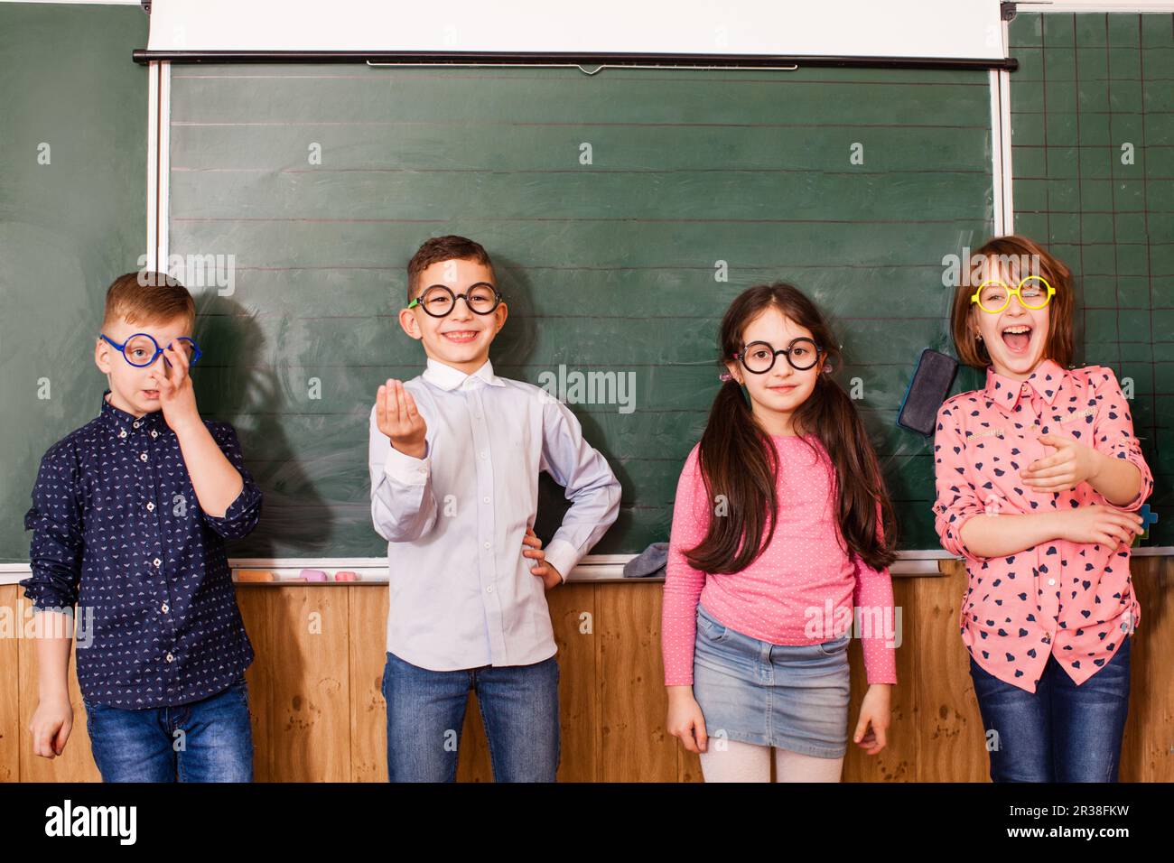 Cool pupils in glasses have fun together during the break Stock Photo ...